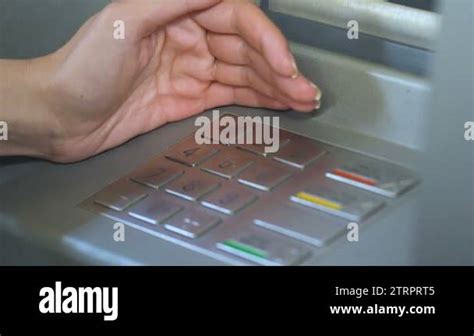 Female Entering Her Pin Code And Hiding Keyboard Of Automated Teller Machine Stock Video Footage