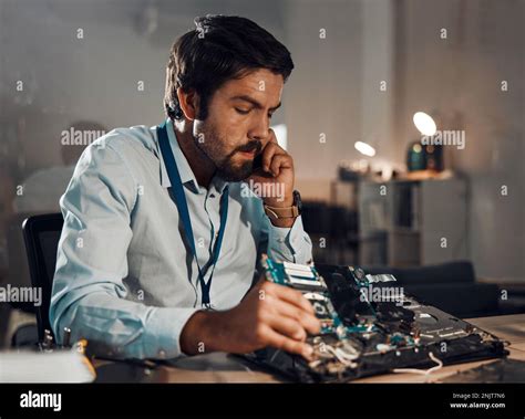 Technology Repair And Thinking With An Man Fixing A Device In An Office For Electrical Or