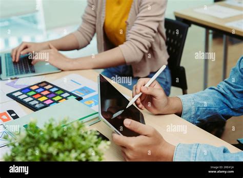 group of asian creative team programing designers participate in all