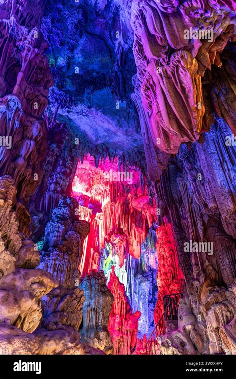 The Beautifully Illuminated Reed Flute Caves Displaying The Crystal