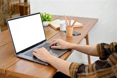 Premium Photo A Young Asian Male Freelancer Typing On Keyboard Working On His Project On Laptop