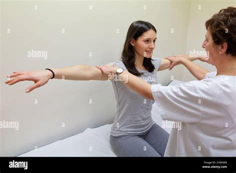 Doctor Checking Arm Abduction Strength Physiotherapy Medical Center
