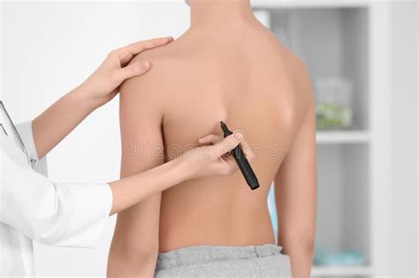 Incorrect Posture Concept Physiotherapist Examining And Correcting Girl S Back Stock Image