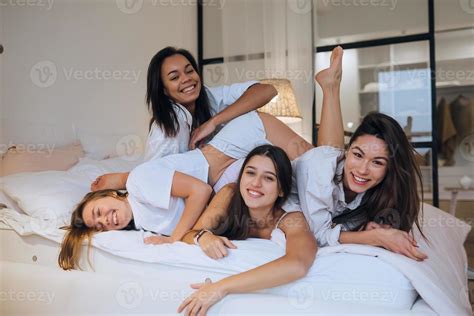 Positive Young Girls Women Friends Indoors On Bed At The Hen Party At
