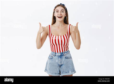 Stylish Cute And Enthusiastic Female Cheerleader In Pin Up Striped Top