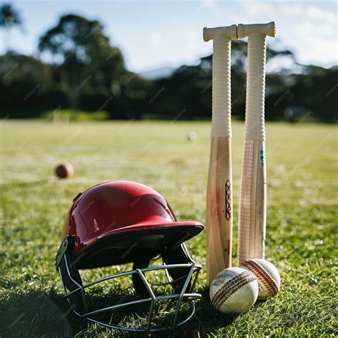 Premium Photo Cricket Helmet And Stumps On The Cricket Pitch