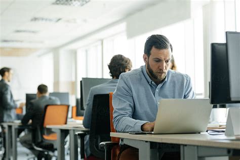 «businessman Typing On His Laptop Del Colaborador De Stocksy «lumina Stocksy