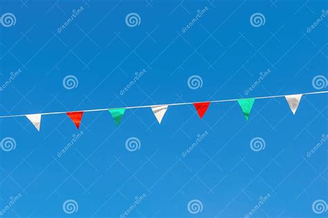 Colorful Triangular Flags Hanging Against Blue Sky Colors Of The