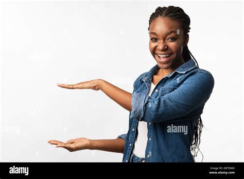 Woman In Braces Holding Invisible Object Standing White Background