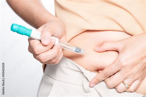 Woman Making Hormonal Therapy Injection Into Her Belly Close Up Syringe Pen Concept
