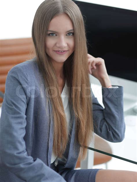 Female Office Employee Sitting At A Desk Stock Image Colourbox
