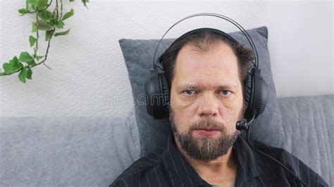 Remote Work From Home In A Call Center A Man In A Headset Working With A Laptop Stock Video