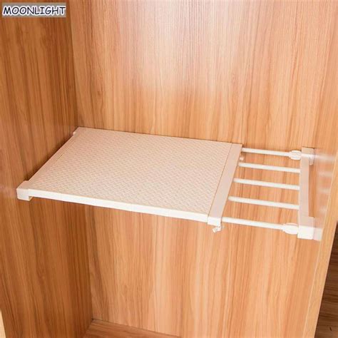 Раздвижная штанга для шкафа под раковину 95 фото