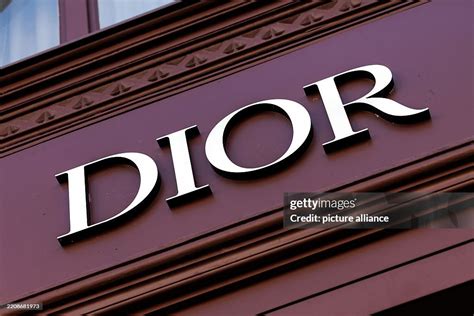 The Logo And Lettering Of The Christian Dior Gmbh Brand Can Be Seen
