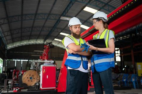 Premium Photo Both Of Engineers Installing And Testing A Large Robotic Arm Before Sending It
