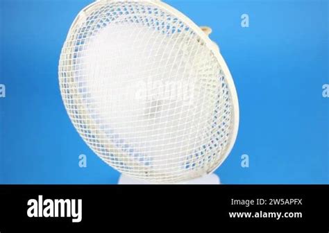 Rotating Retro Fan Ventilator On Blue Screen Background Vintage Electrical Conditioning And Air