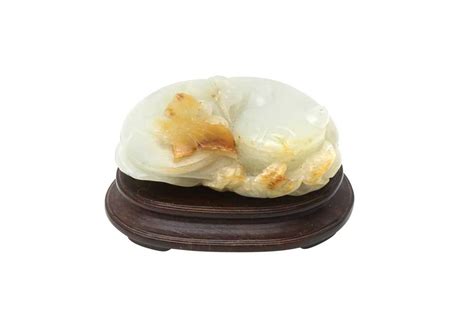 Lot 124 A Chinese White And Russet Jade Cat And
