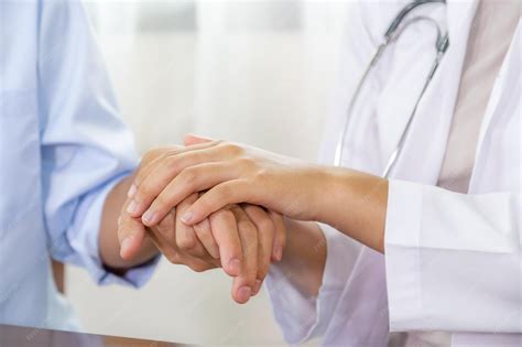 Premium Photo Doctor Holding Patient Hand To Encourage And Explained