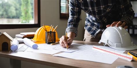 Premium Photo Engineer Architect Designer Freelance Work On Startup Project Drawing