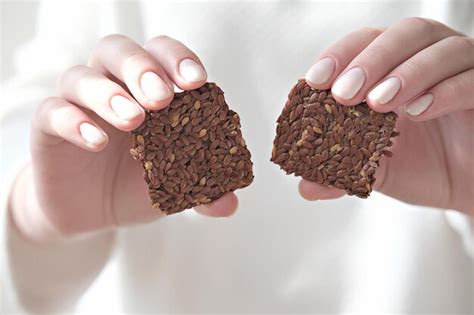 Premium Photo Hand Holding Crunchy Multigrain Cereal Flax Seed