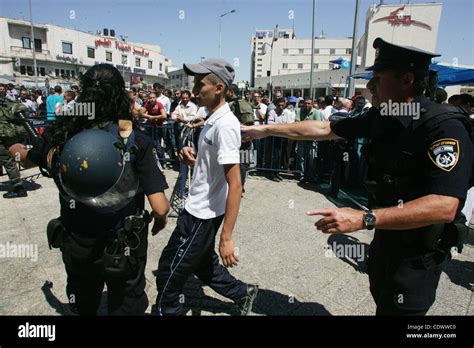 Israeli Police And Riot Police Keep Back A Crowd Of Palestinian Muslims