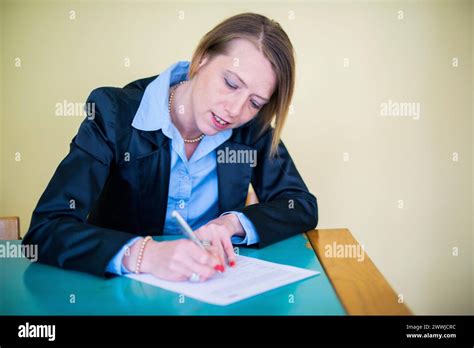 Blonde Female Signing Form Tilburg Netherlands Attractive Blonde Woman Signing A Model Release