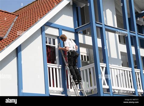 A Painter At Work On The Scaffold Stock Photo Alamy