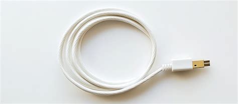 White Usb Cable On White Background Premium Ai Generated Psd