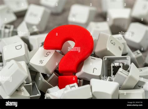 Red Plastic Question Mark In The Pile Of Computer Keyboard Keys Stock Photo Alamy