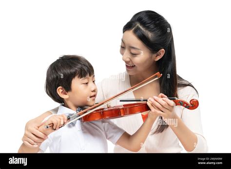 The Female Teacher Guide The Boy Playing Musical Instruments Stock