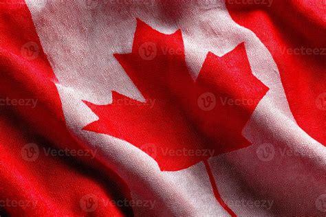 Close Up Of The Canadian Flag With Vibrant Red And White Colors And A