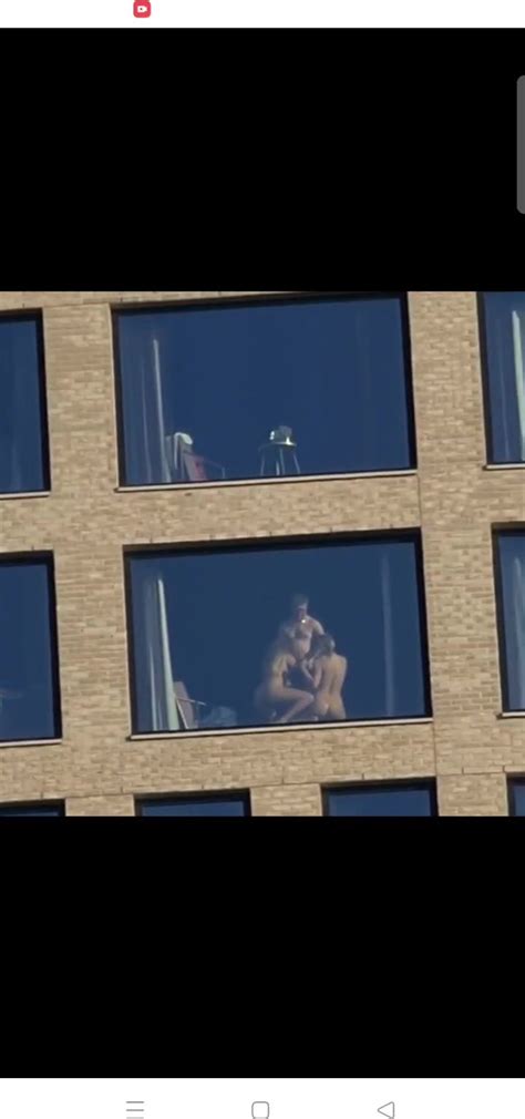 2 Woman 1 Men Before Window In Amsterdam 2 Woman 1 Men Before Window In Amsterdam