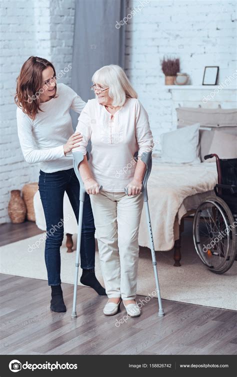Someone Helping Old Lady Young Woman Helping Elderly Lady Hi Res Stock