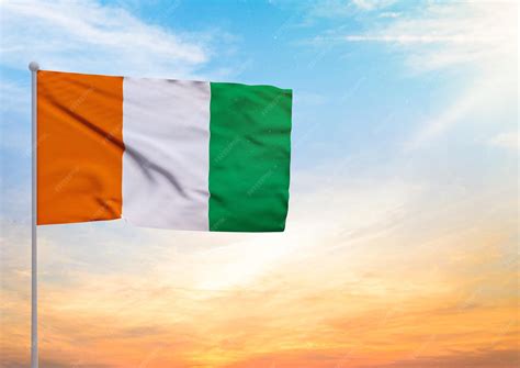 Premium Photo Ivory Coast Flag Extended On A Flagpole And In The
