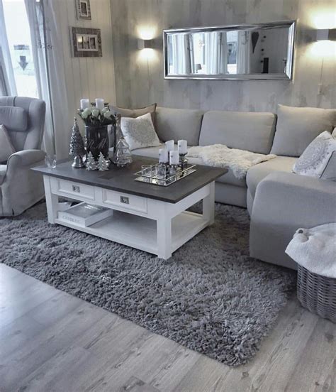 Light Grey Sofa With Two Tone White Coffee Table Atop A Darker Grey