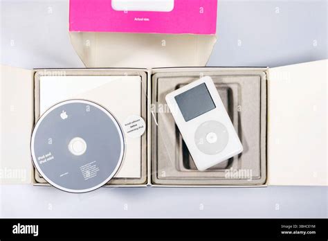Open Box Containing A Classic Apple Ipod And Software Cd Showcasing
