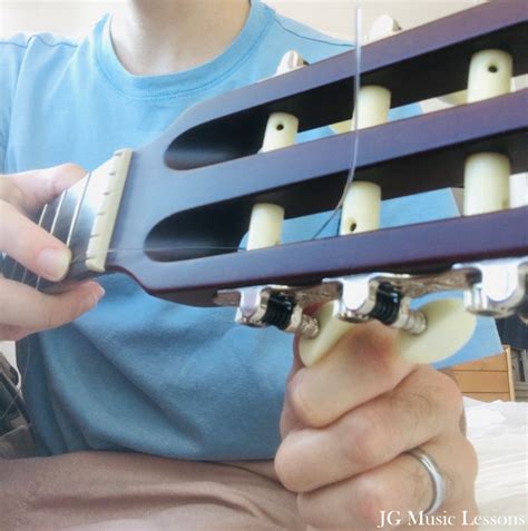 How To Change Strings On An Acoustic Guitar Nylon JG Music Lessons