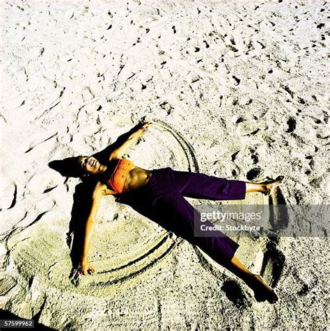Beach Sand Angel Stockfotos En Beelden Getty Images