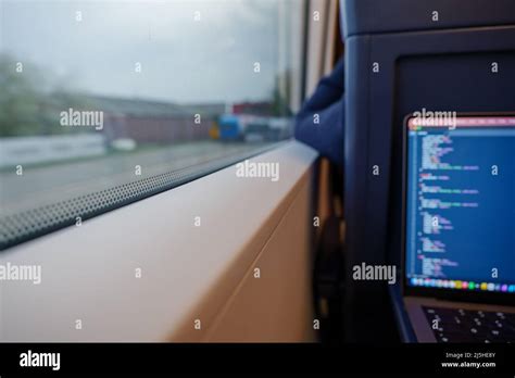 Selective Focus Open Laptop Or Notebook Working As Programmer And Do Some Coding On The Train