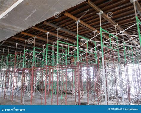 Metal Scaffolding Is Used As A Temporary Structure That Supports Works At The Construction Site