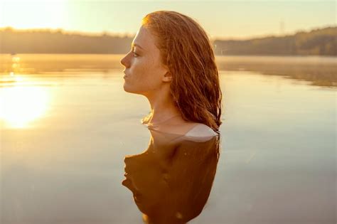 Premium Photo Beautiful Redhead Woman As Mermaid With Giant Seashell