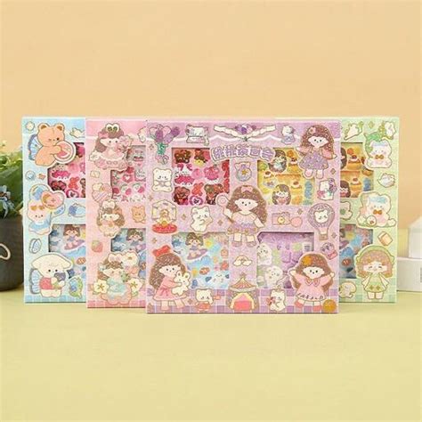 خرید و قیمت پک صد ورقی استیکر فانتزی در طرح های مختلف فانتزی برچسب