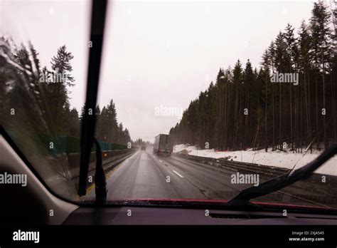 Drivers Perspective Through Windshield Of Winter Highway With Semi