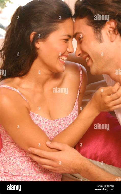 Couple Sitting On Sofa Profile Of Female Long Brunette Hair Wearing