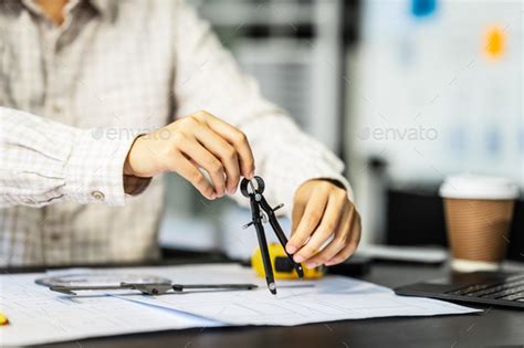 Female Architect Engineer Is Drafting Blueprints Using CAD Software Focusing On Sustainable