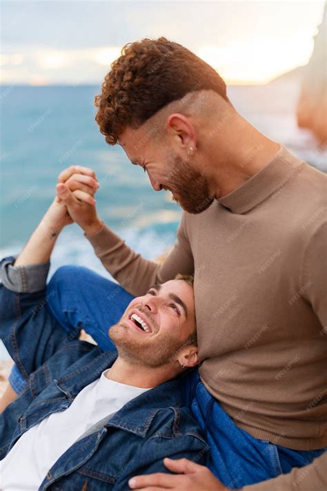 Free Photo Affectionate Gay Couple Spending Time On The Beach Together