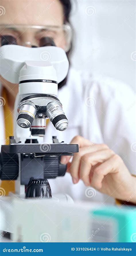 Woman Scientist Using Microscope In Laboratory Microbiology Science