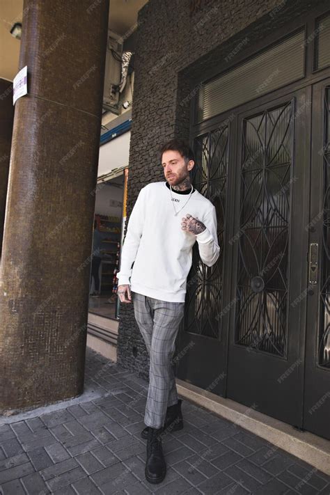 Premium Photo | A man walking down the street in front of a door that ...