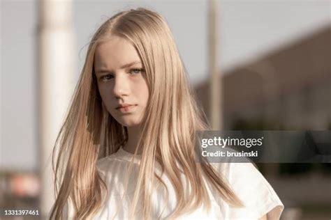 Outdoors Portrait Of 15 Year Old Blonde Teen Girl With Long Hair In