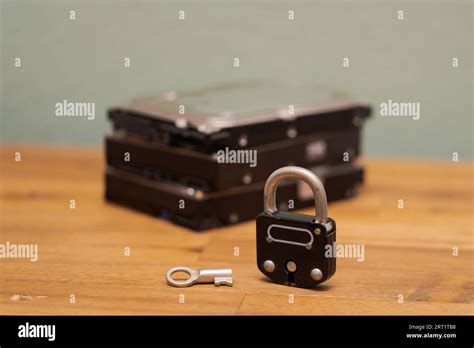 Computer Hard Disks And Metal Padlock Symbolizing Concept For Encrypted
